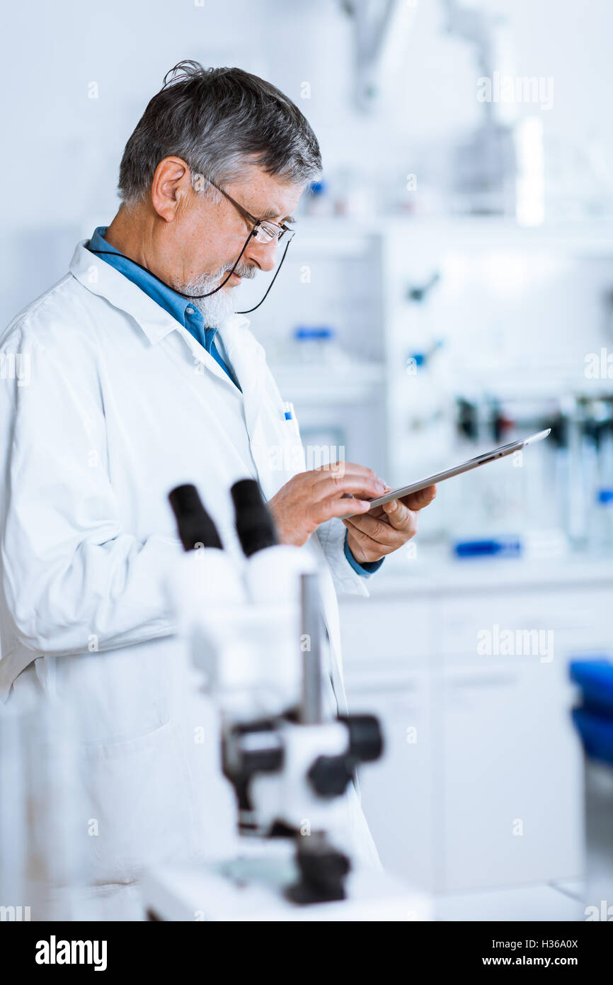Senior male researcher carrying out scientific research in a lab Stock ...