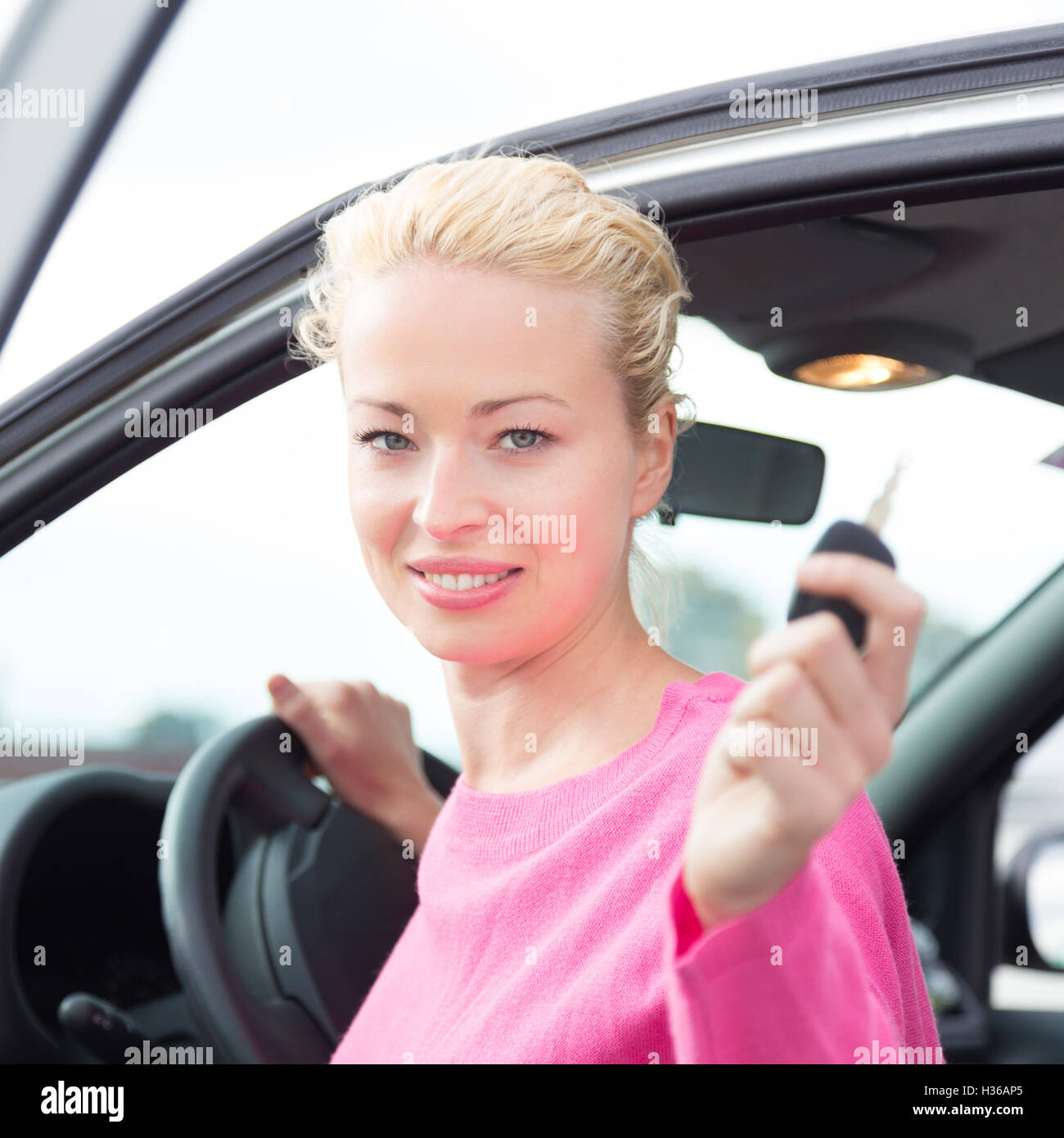 Woman driver showing car keys Stock Photo - Alamy