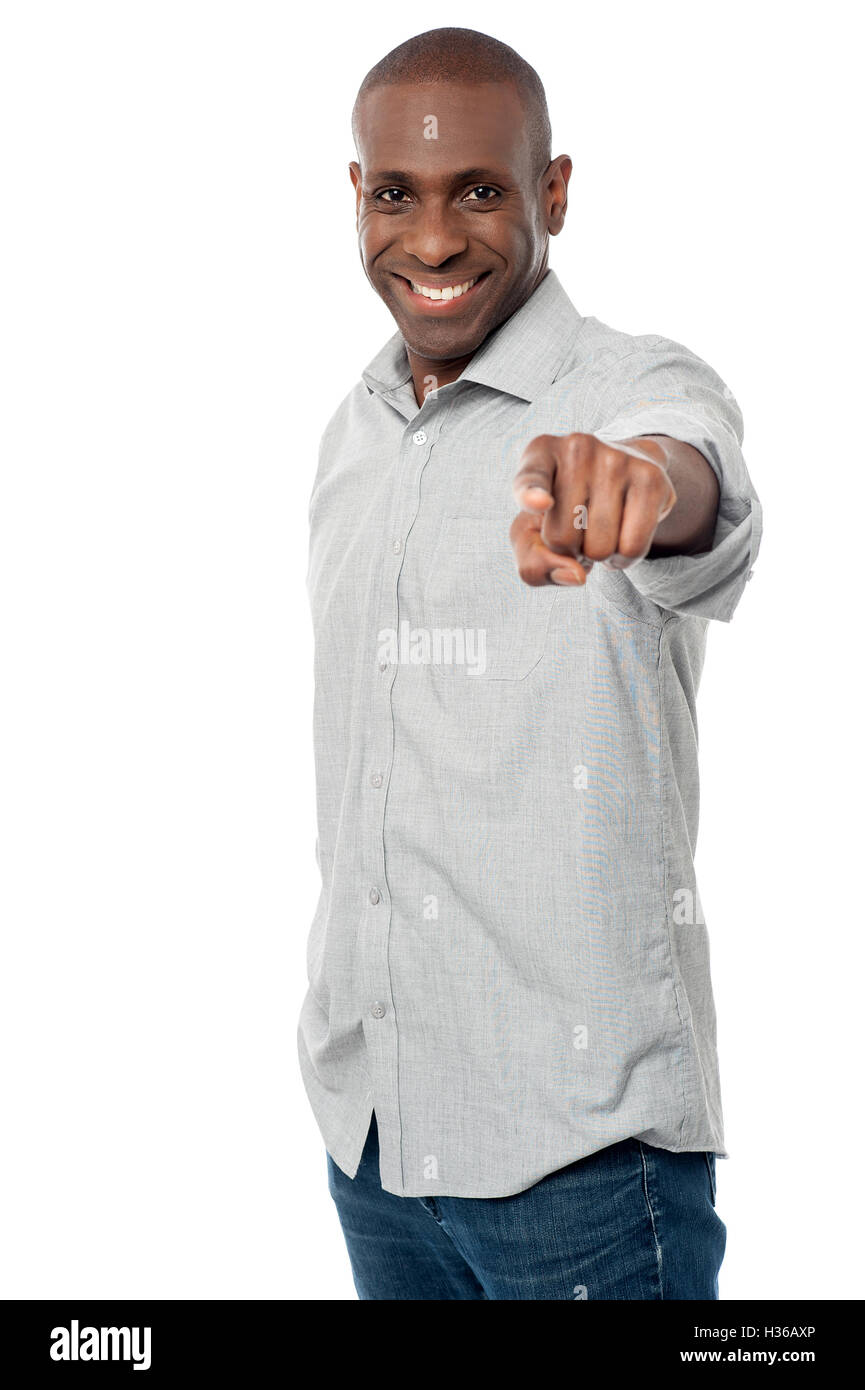 Smiling guy pointing you out Stock Photo - Alamy