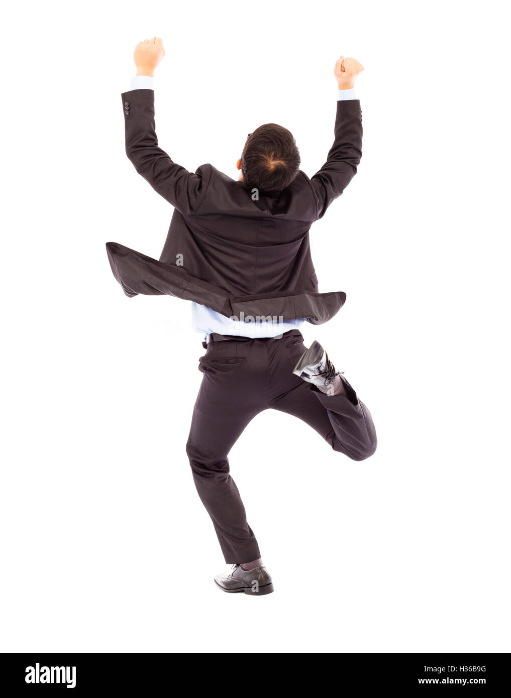 excited businessman raising hands while running happily Stock Photo - Alamy