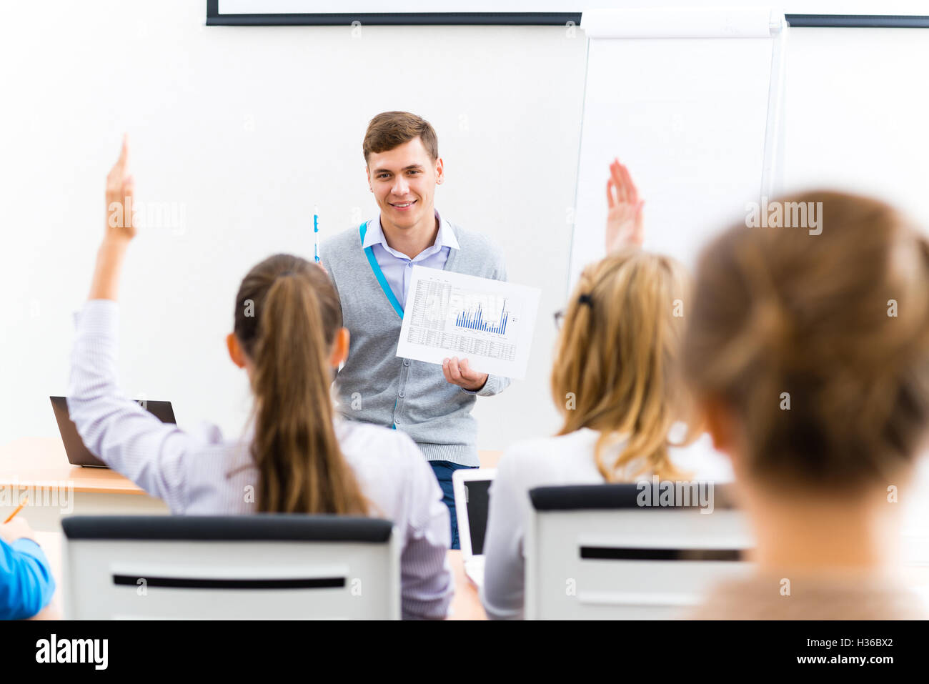 teacher talking with students Stock Photo - Alamy