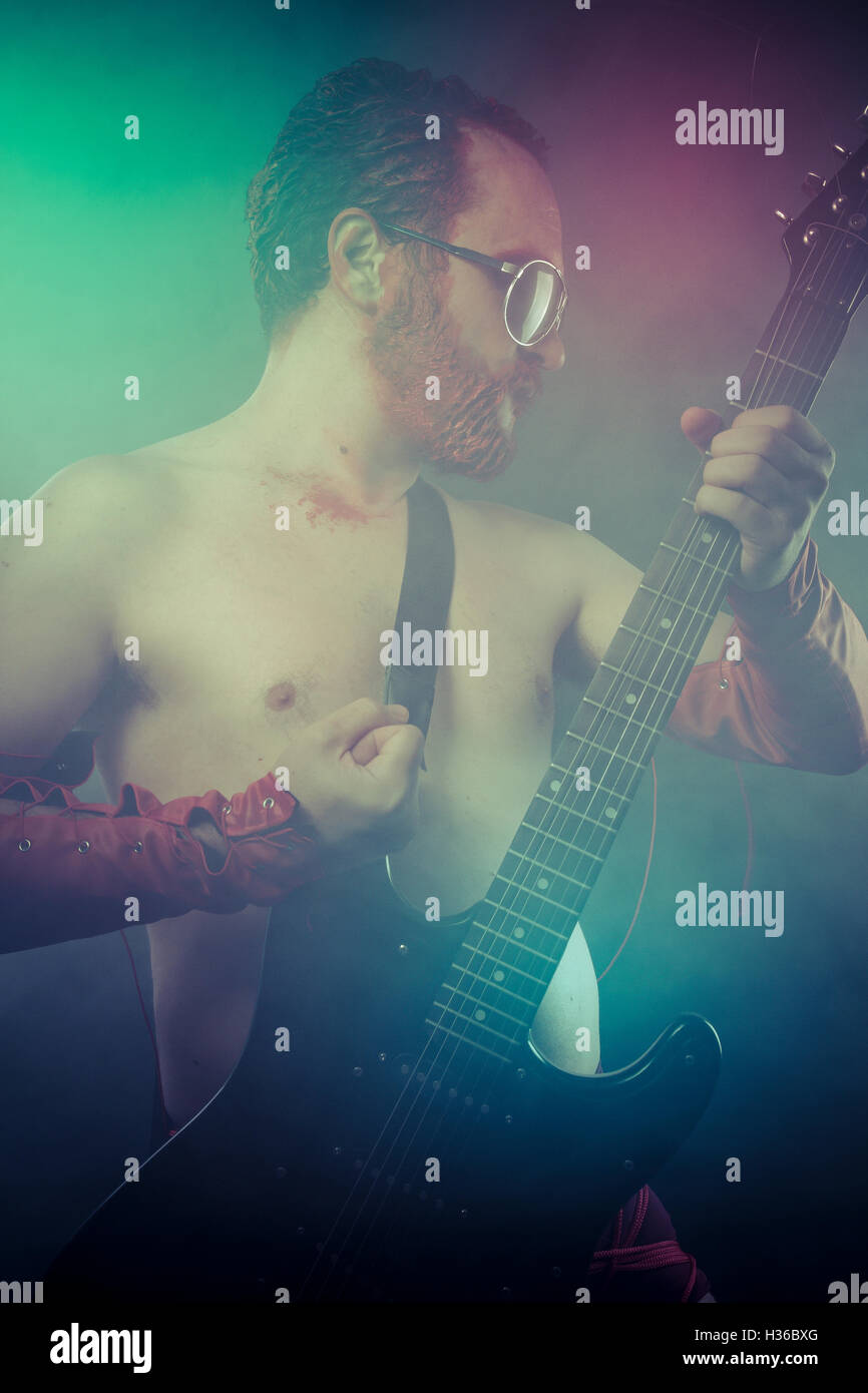 Music, rocker man with electric guitar in a rock concert Stock Photo ...