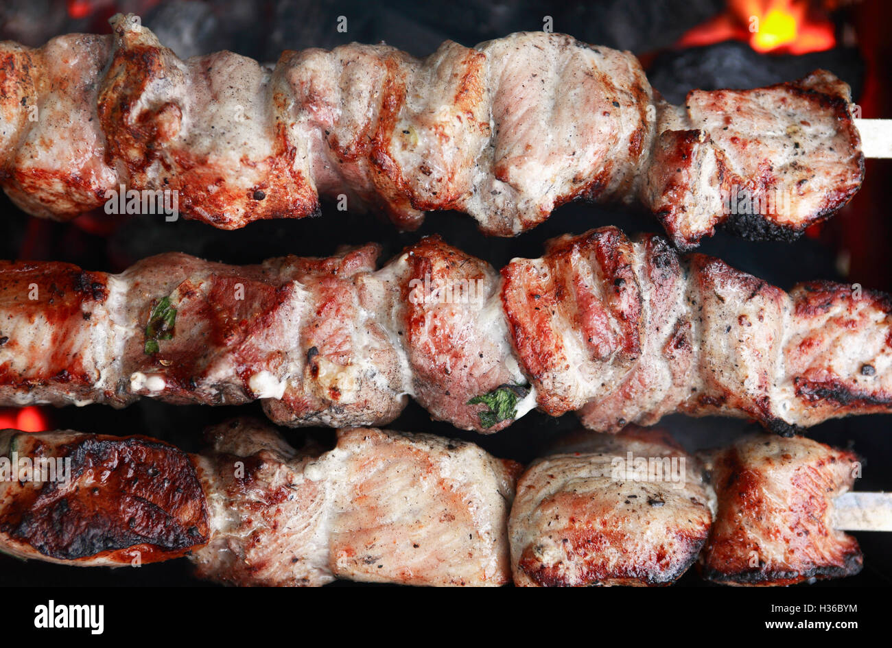 Meat Grilled On Fire Stock Photo - Alamy