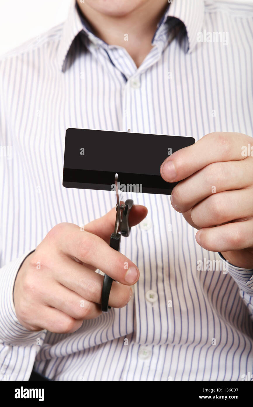 Closeup of caucasian hands cutting up credit card hi-res stock ...