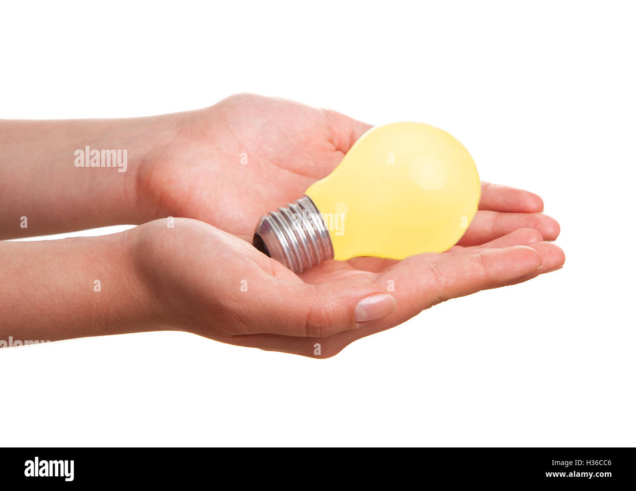 Light bulb in hand, isolated on white background Stock Photo - Alamy