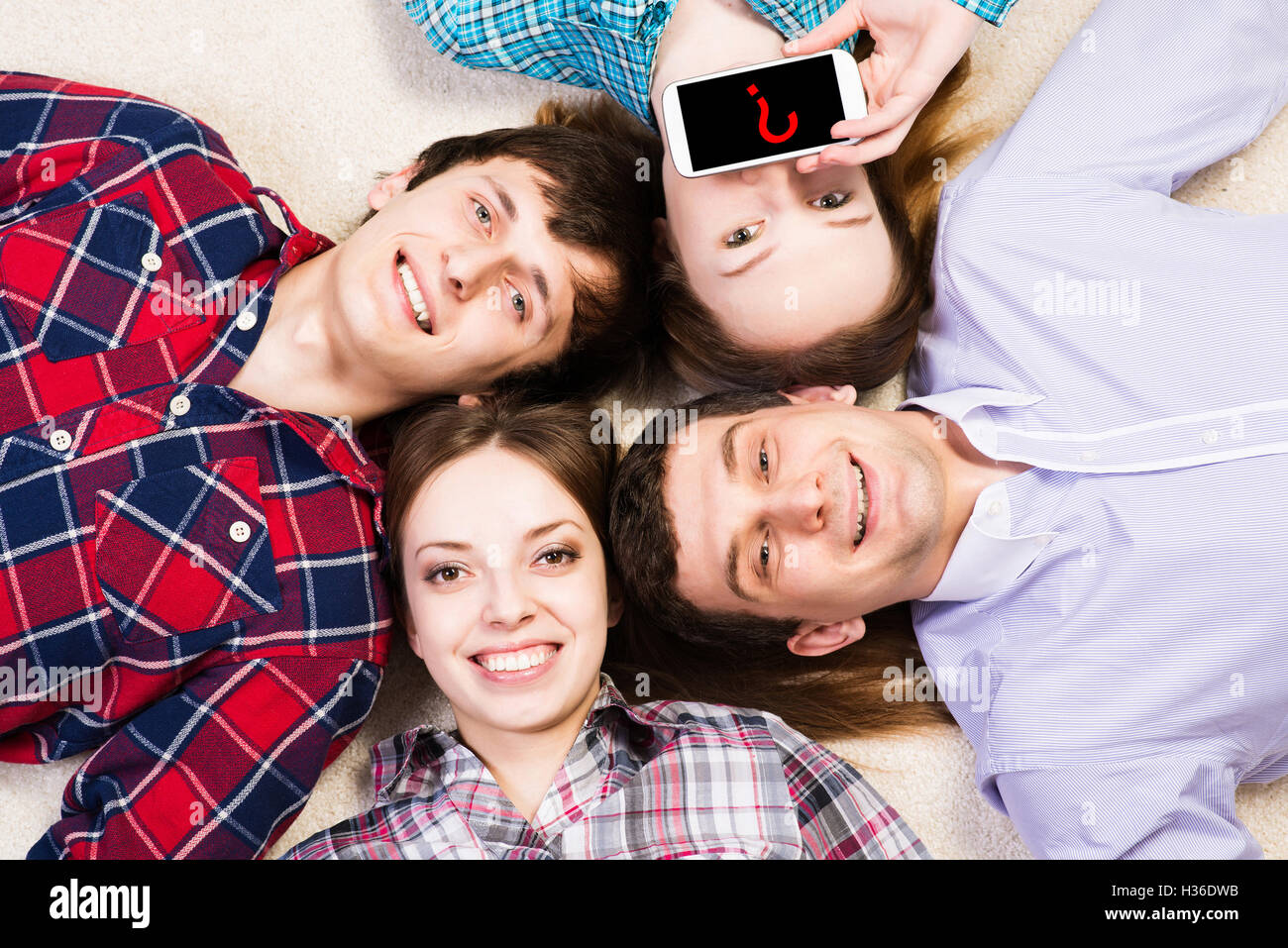 four young men lie together Stock Photo - Alamy