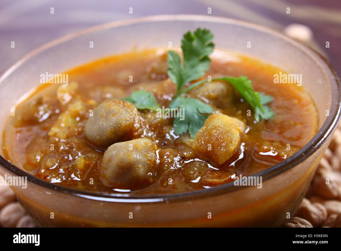 indian spicy chana masala, raw chickpeas around bowl Stock Photo - Alamy