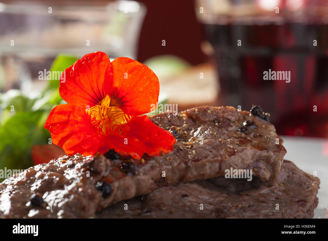 grilled steak with indian cress flower Stock Photo - Alamy