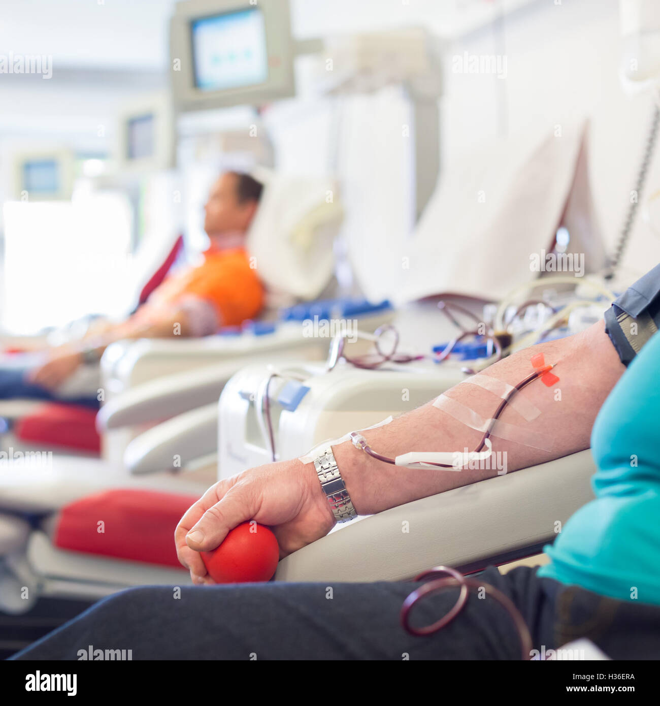 Blood donor at donation Stock Photo - Alamy