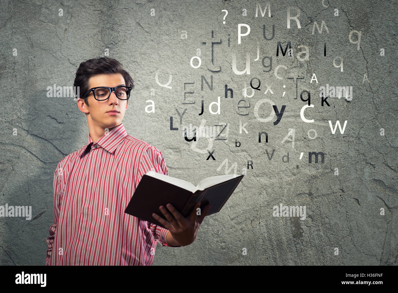 young man scientist with book Stock Photo - Alamy