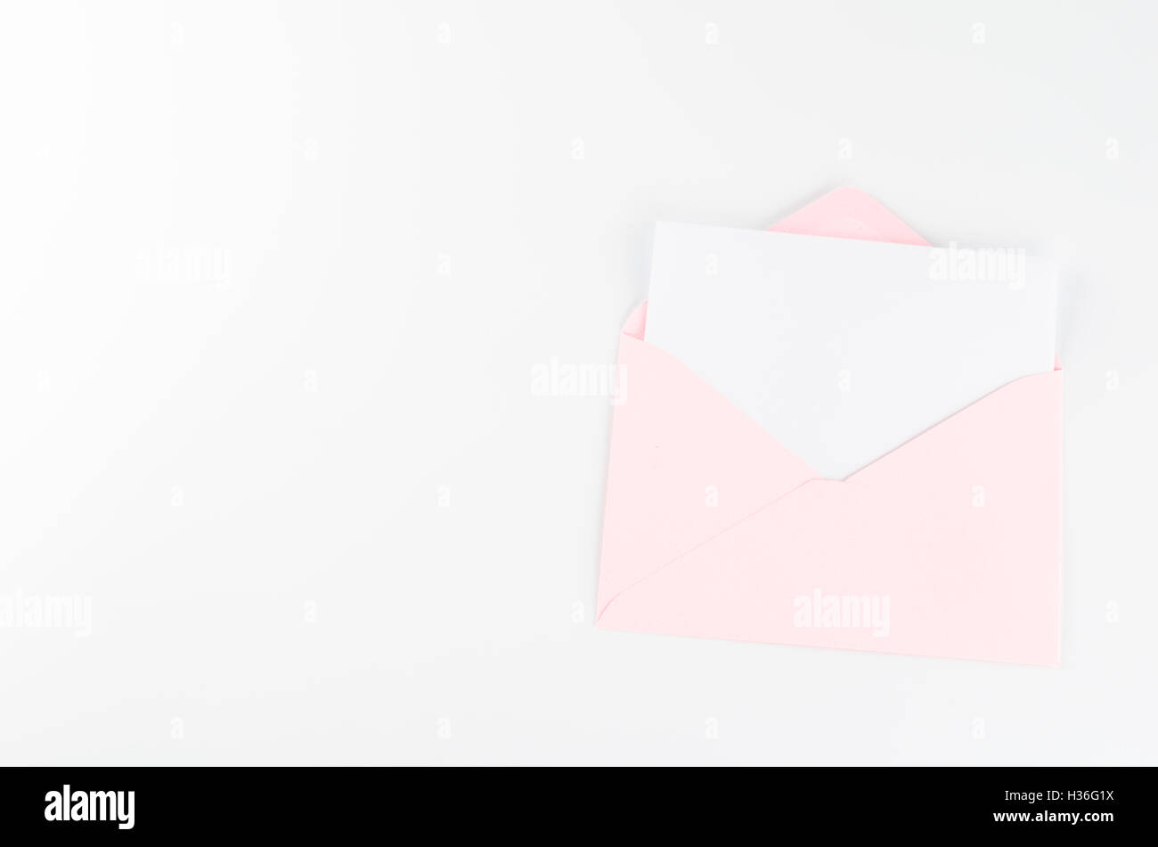 open envelope with white paper Stock Photo - Alamy