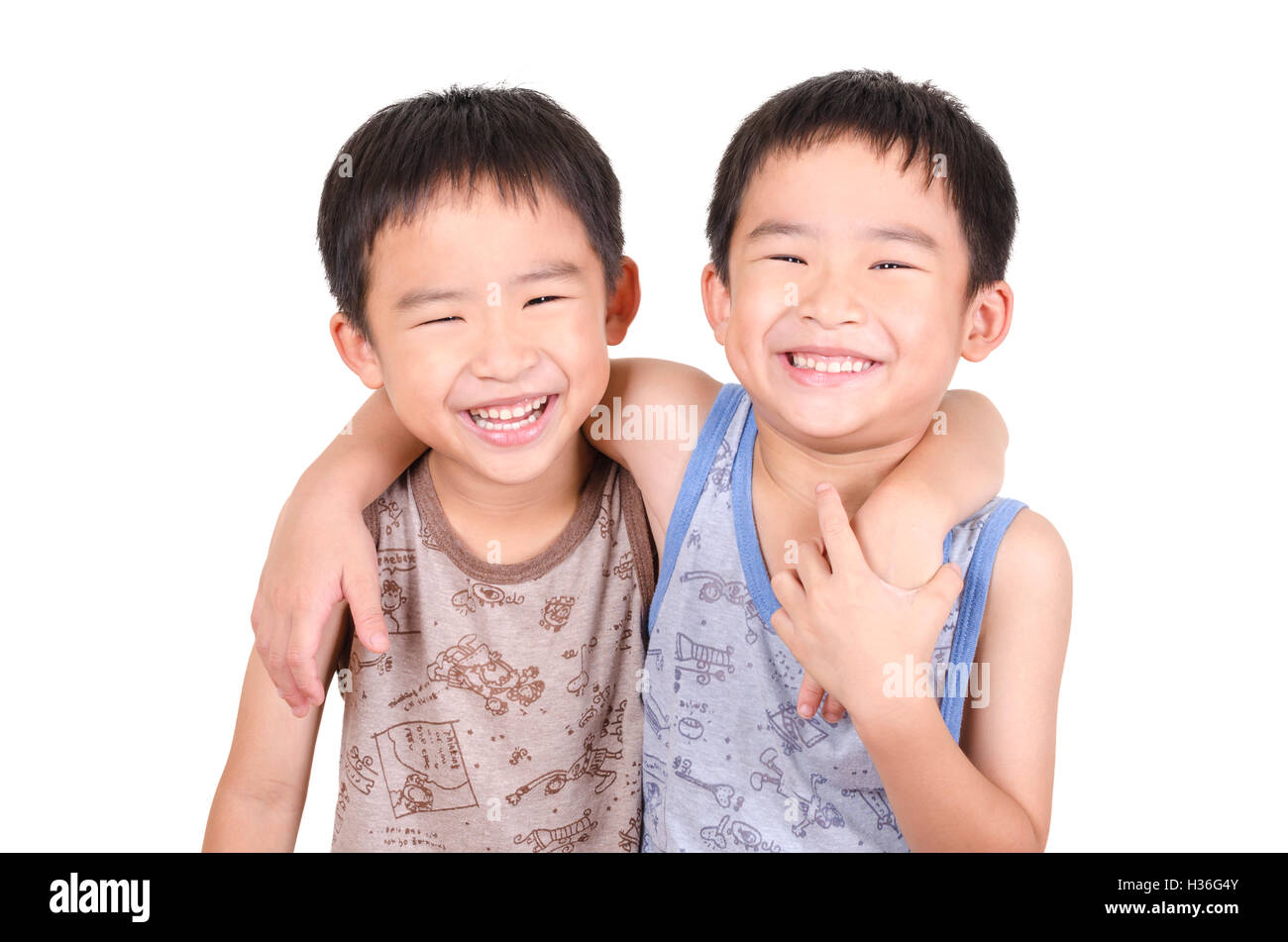 Cute twins smiling Stock Photo - Alamy