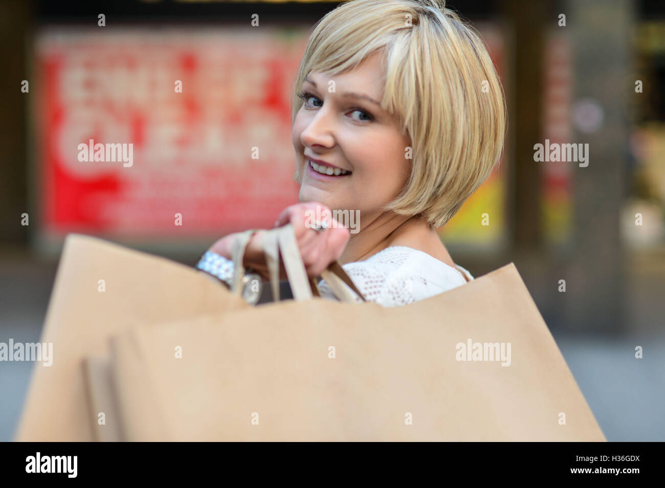 Woman enjoying her day out, shopping Stock Photo - Alamy