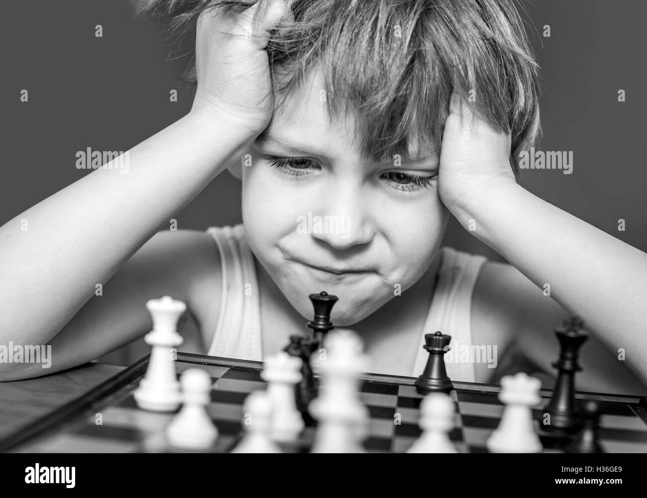 Boy playing chess Stock Photo - Alamy