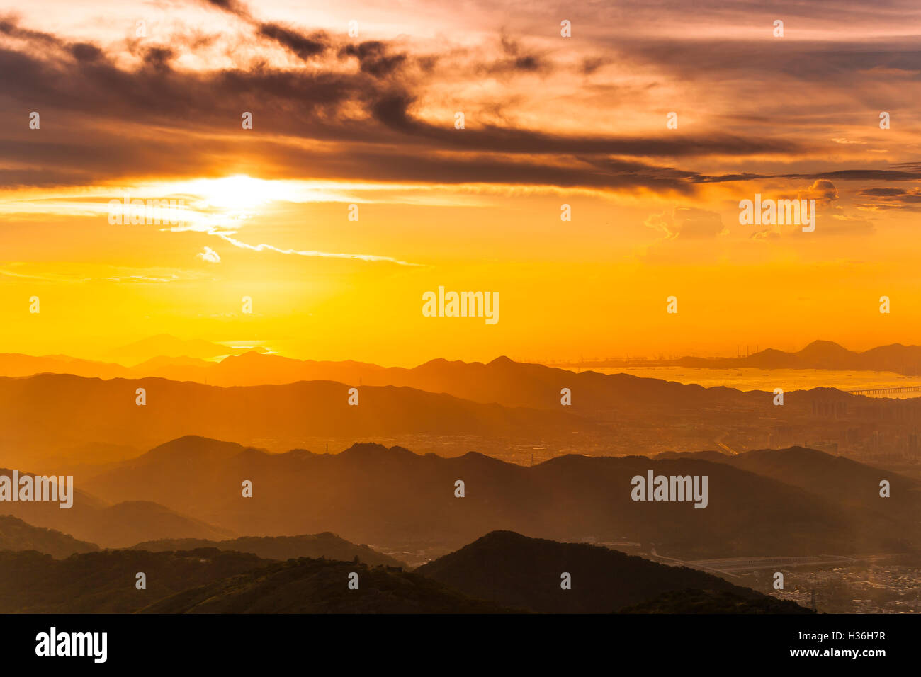 Sunset at mountain landscape Stock Photo - Alamy