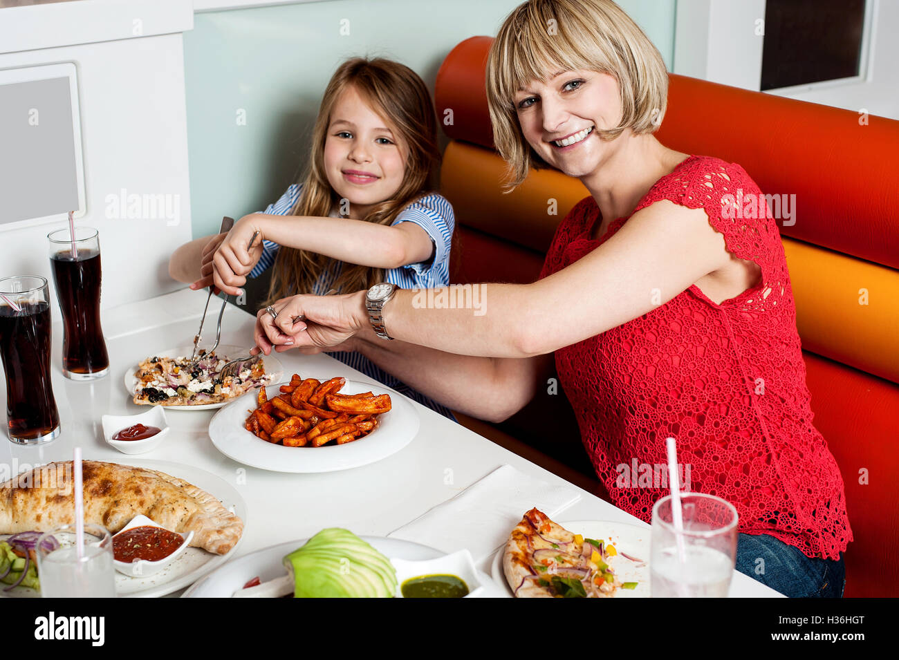 Mother and daughter in a restaurant Stock Photo - Alamy