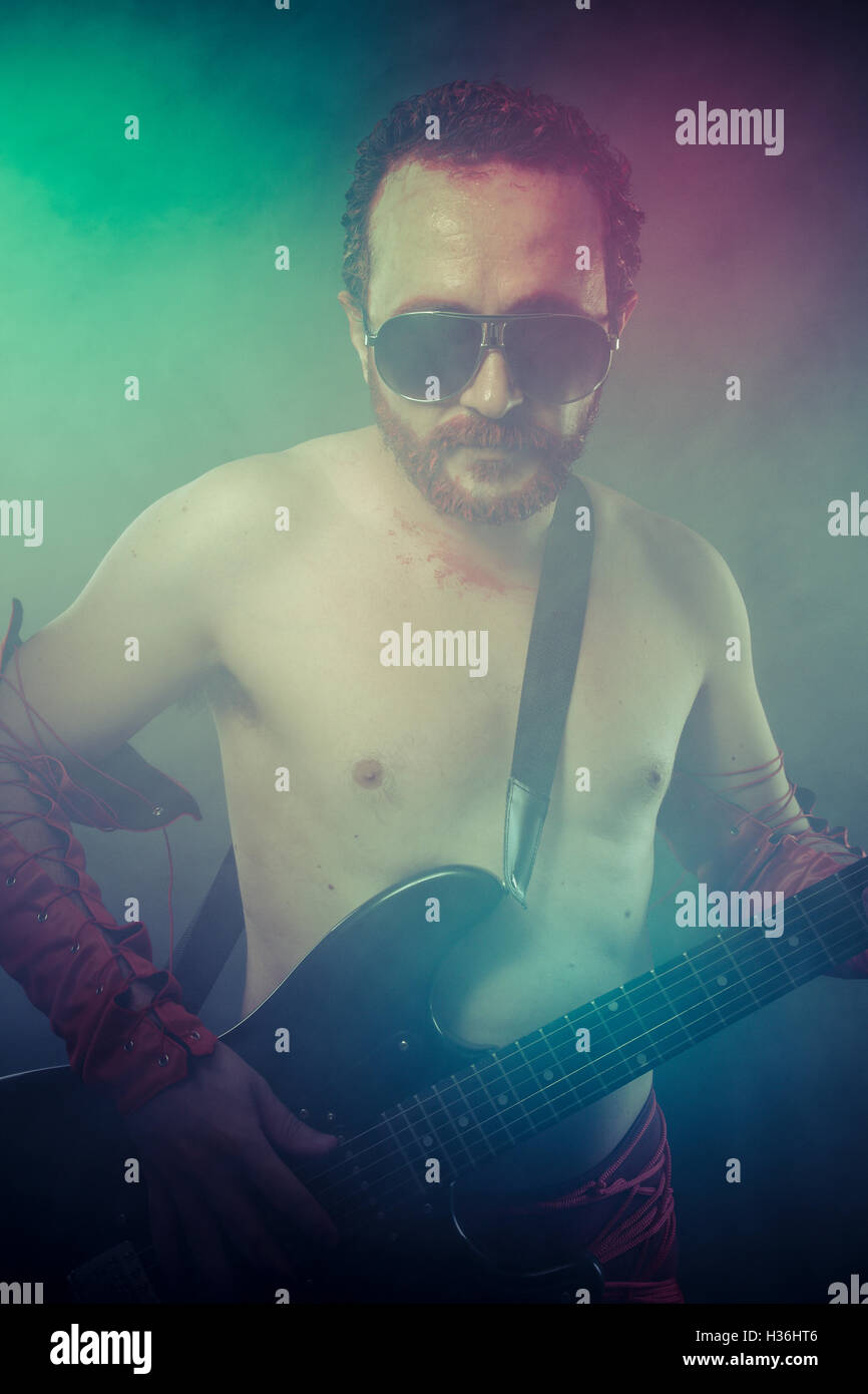 Music, rocker man with electric guitar in a rock concert Stock Photo ...