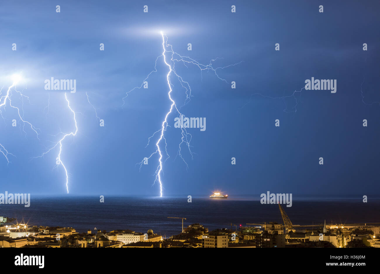 Massive cloud to ground lightning bolts hitting the horizon of city ...