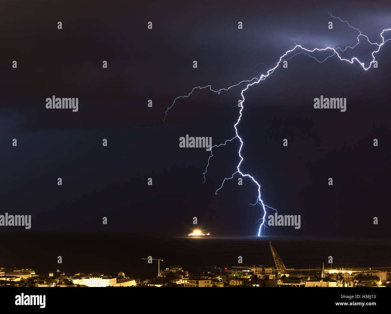 Massive cloud to ground lightning bolts hitting the horizon of city ...