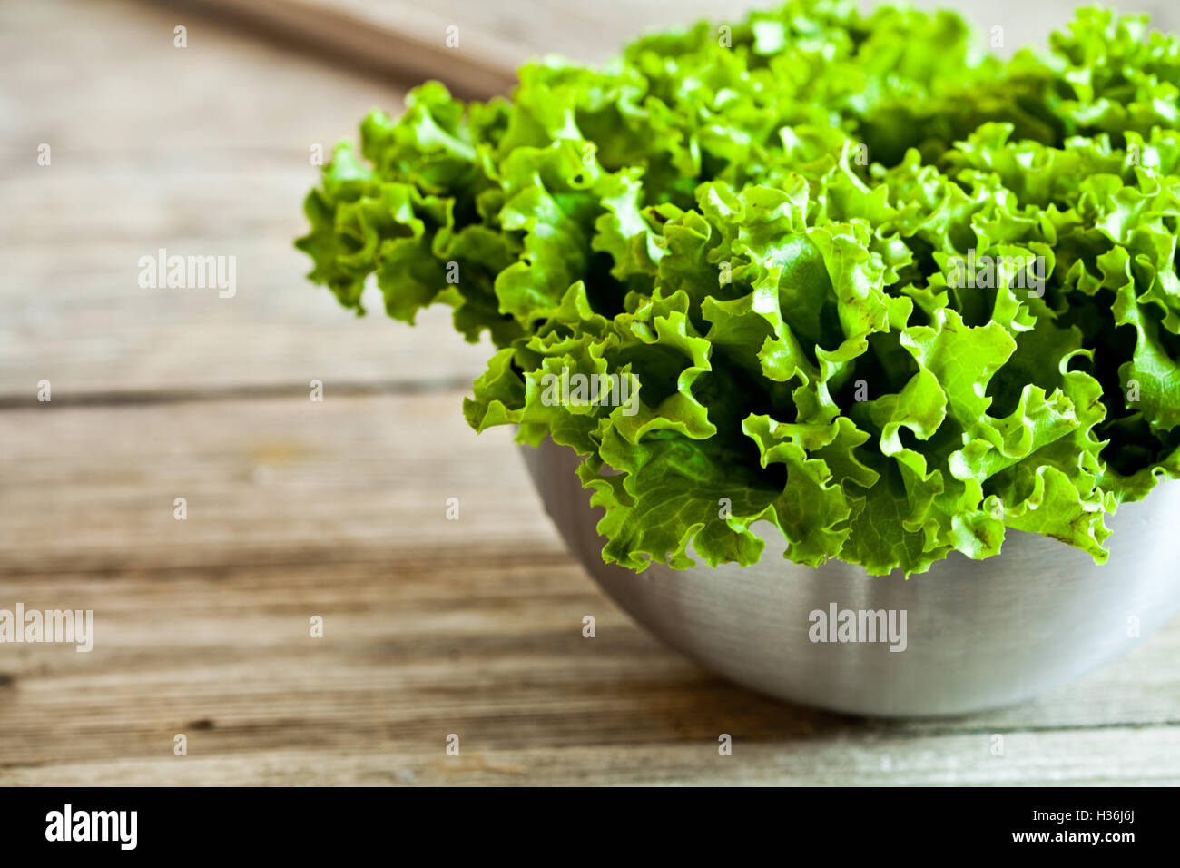 lettuce salad in metal bowl Stock Photo - Alamy