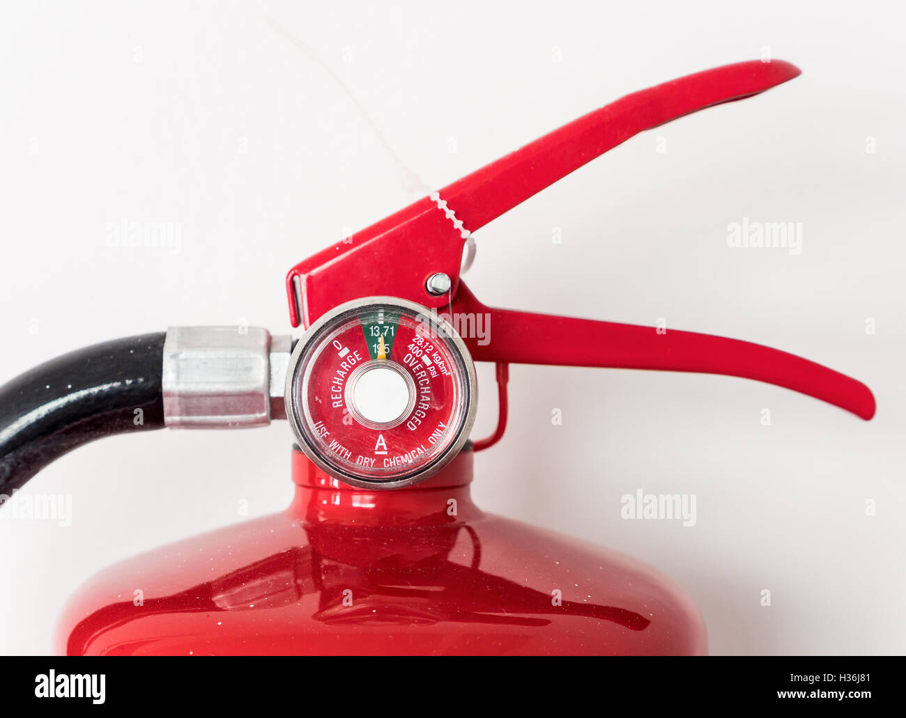 Modern gauge of the fire extinguisher on the white wall Stock Photo - Alamy