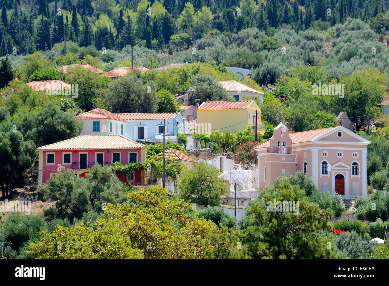 Pink church and colourful houses Assos Kefalonia Ionian Islands Greece ...