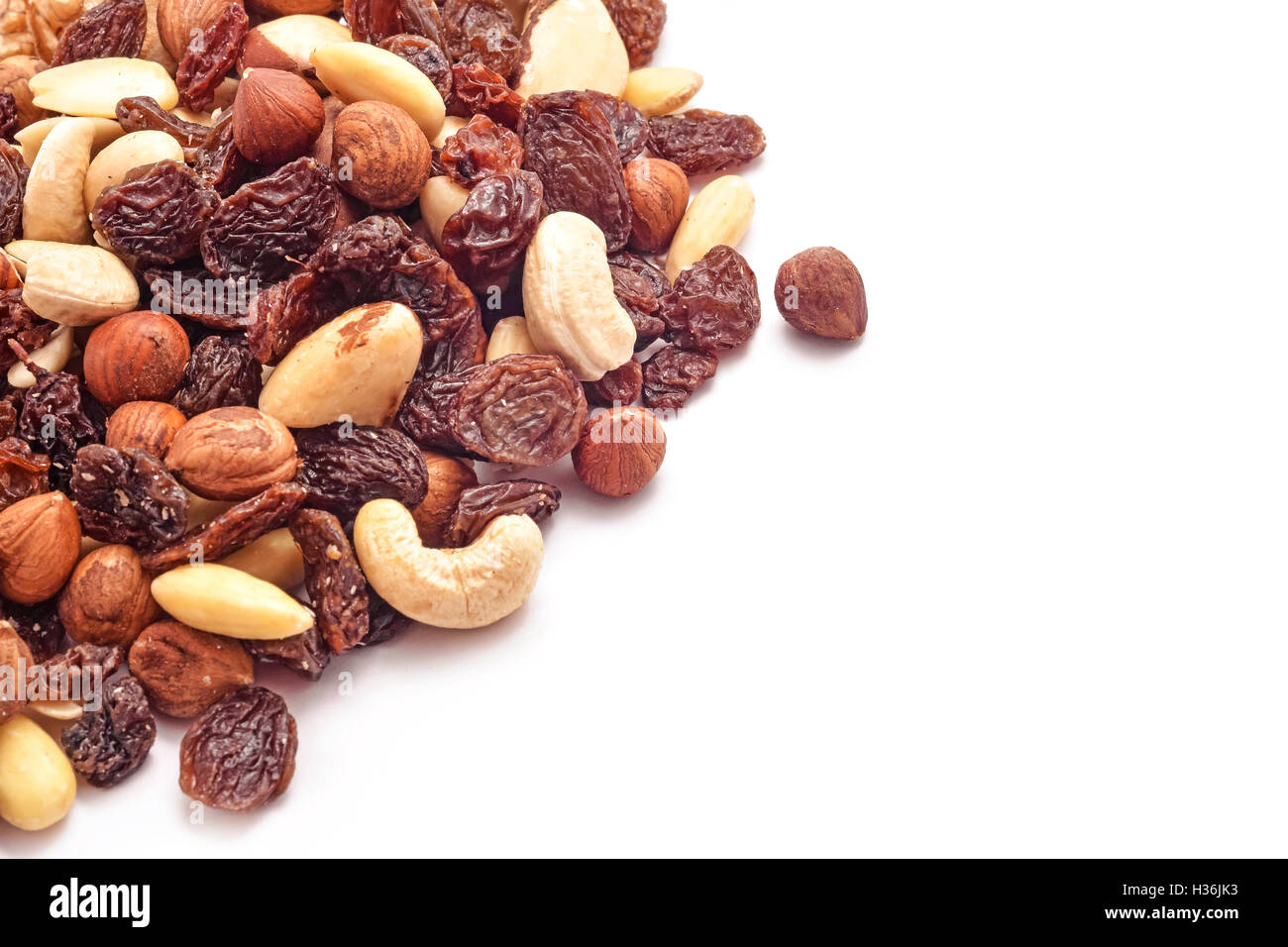 dry nuts and raisins mix isolated Stock Photo - Alamy