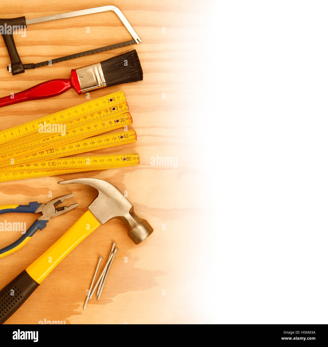 Assorted work tools on wood Stock Photo - Alamy