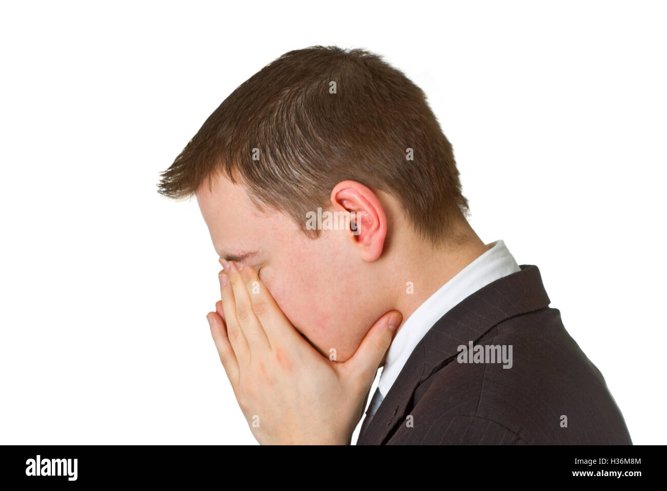 Businessman hiding his face in shame isolated on white background Stock ...