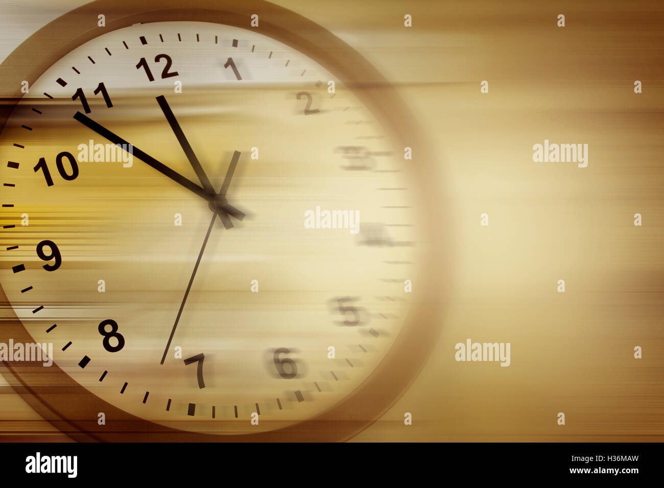 Blurred clock on brown background Stock Photo - Alamy