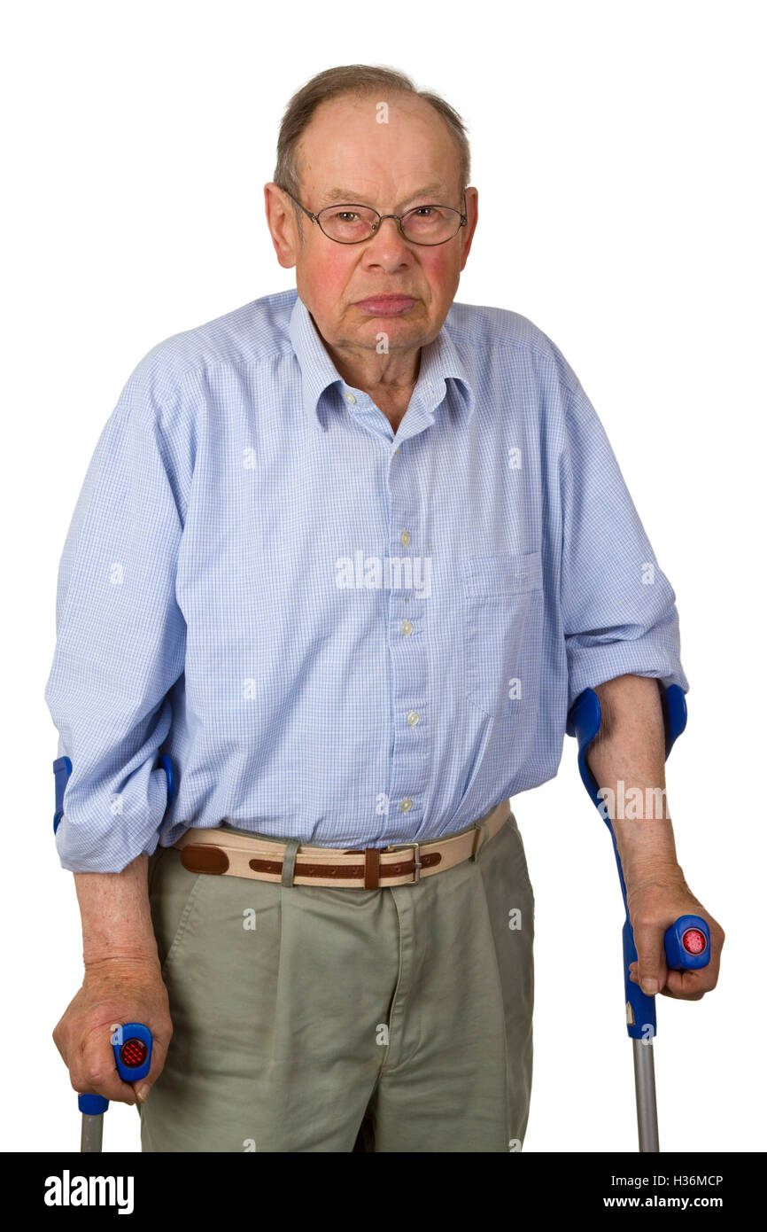 Male senior on crutches isolated on white background Stock Photo - Alamy