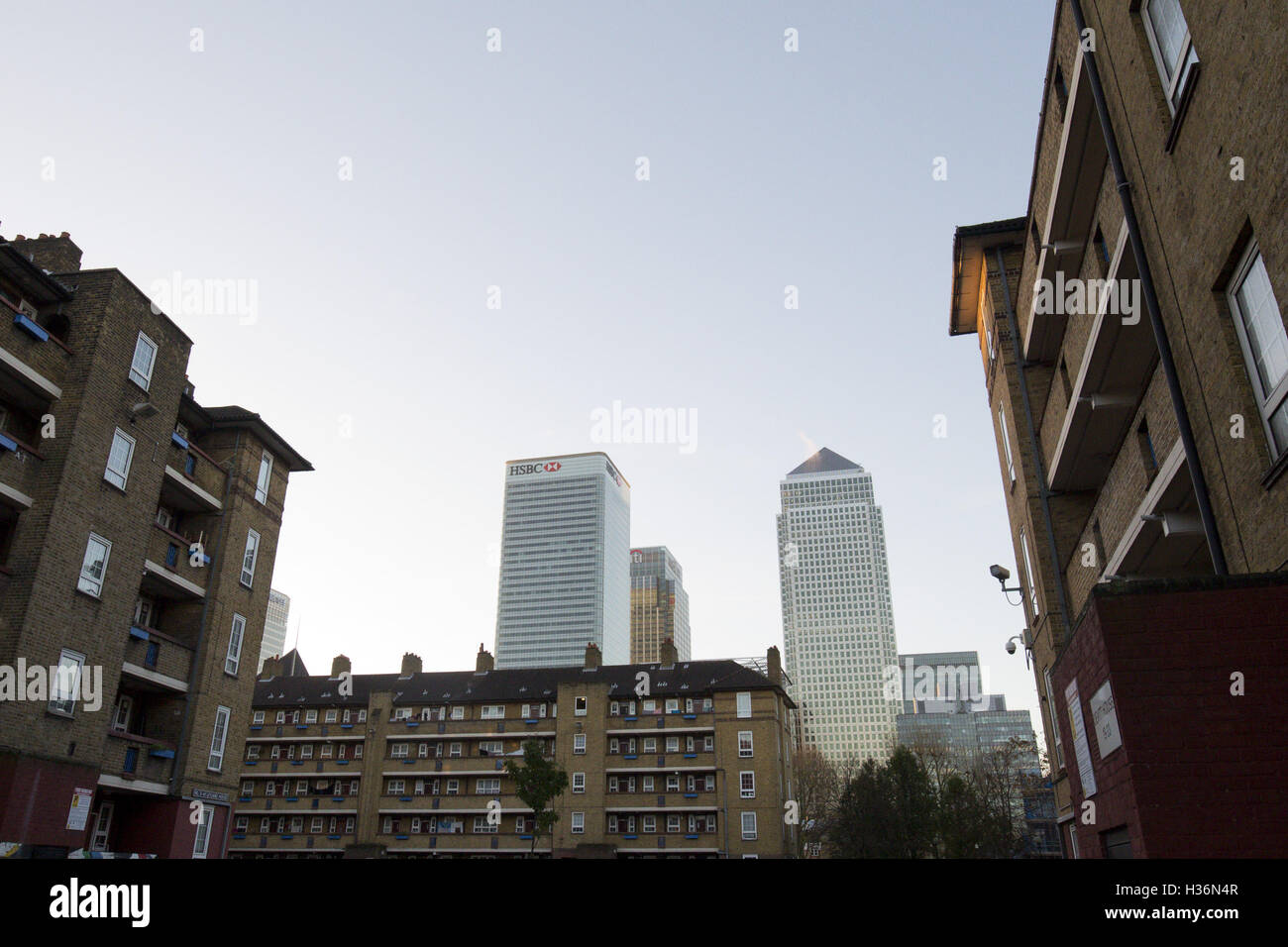 A Tower Hamlets estate is pictured with HSBC & No.1 Canada Square ...
