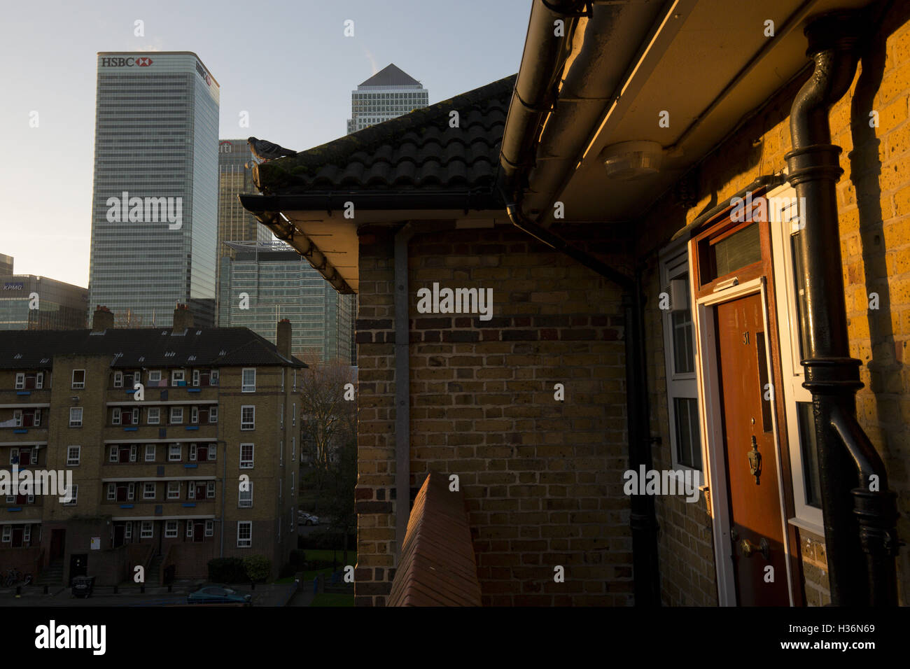 A Tower Hamlets estate is pictured with HSBC & No.1 Canada Square ...