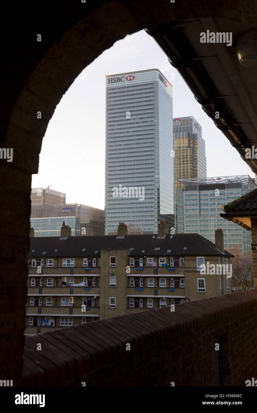 A Tower Hamlets estate is pictured with HSBC tower of Canary Wharf in ...