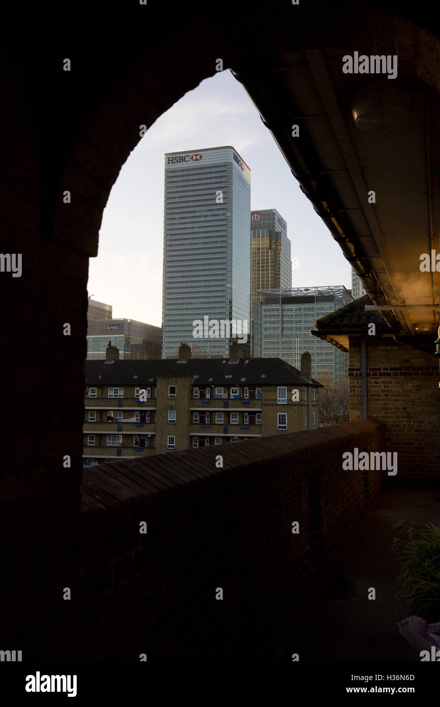 A Tower Hamlets estate is pictured with HSBC tower of Canary Wharf in ...