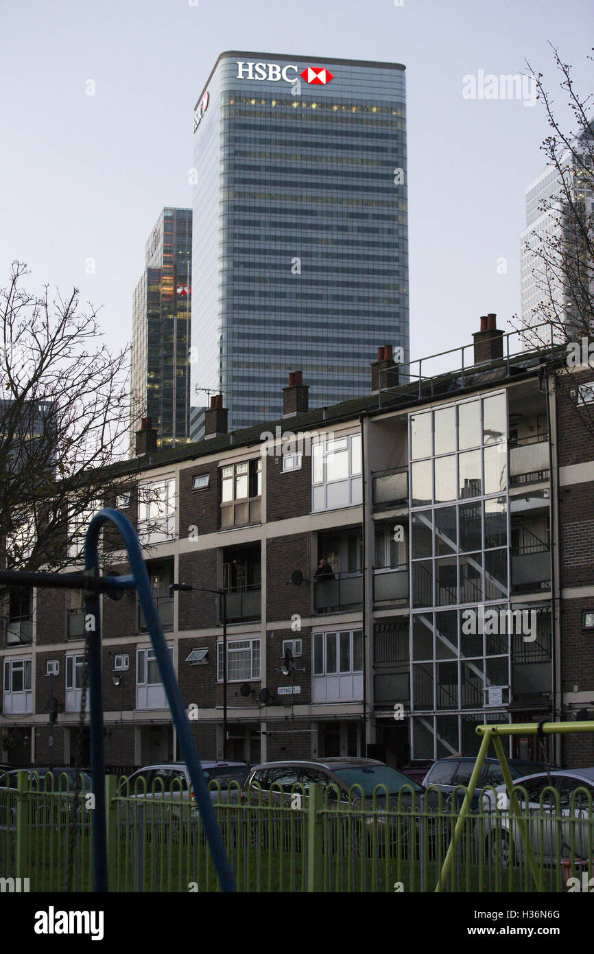 A Tower Hamlets estate is pictured with HSBC tower of Canary Wharf in ...