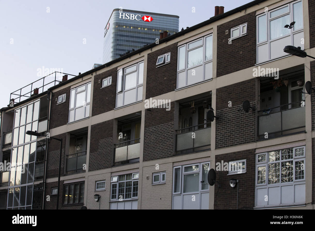 A Tower Hamlets estate is pictured with HSBC tower of Canary Wharf in ...