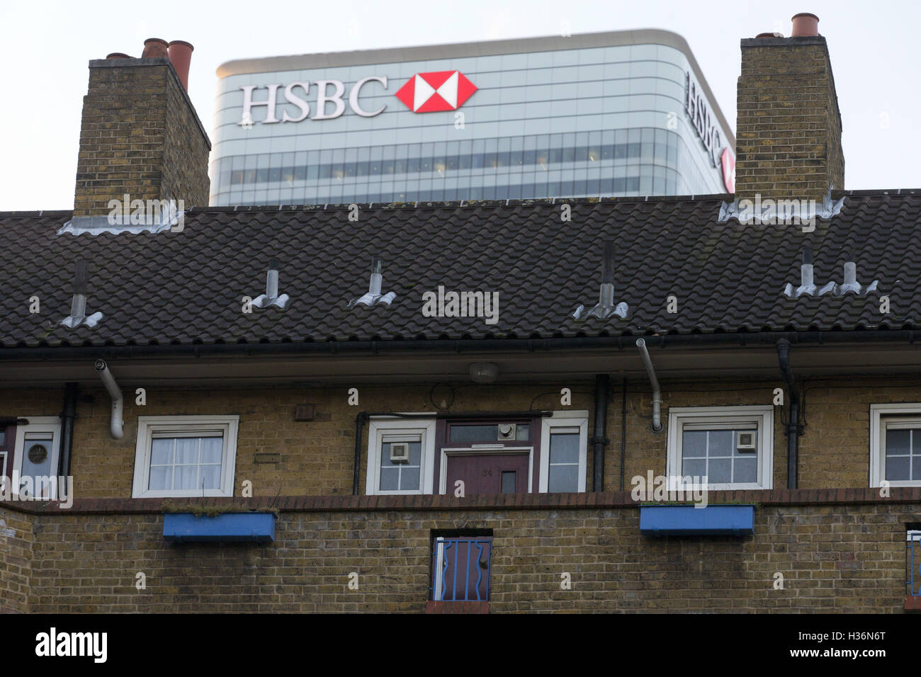 A Tower Hamlets estate is pictured with HSBC tower of Canary Wharf in ...