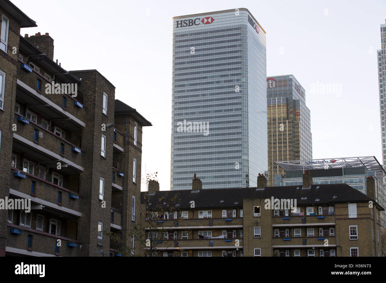 A Tower Hamlets estate is pictured with HSBC tower of Canary Wharf in ...