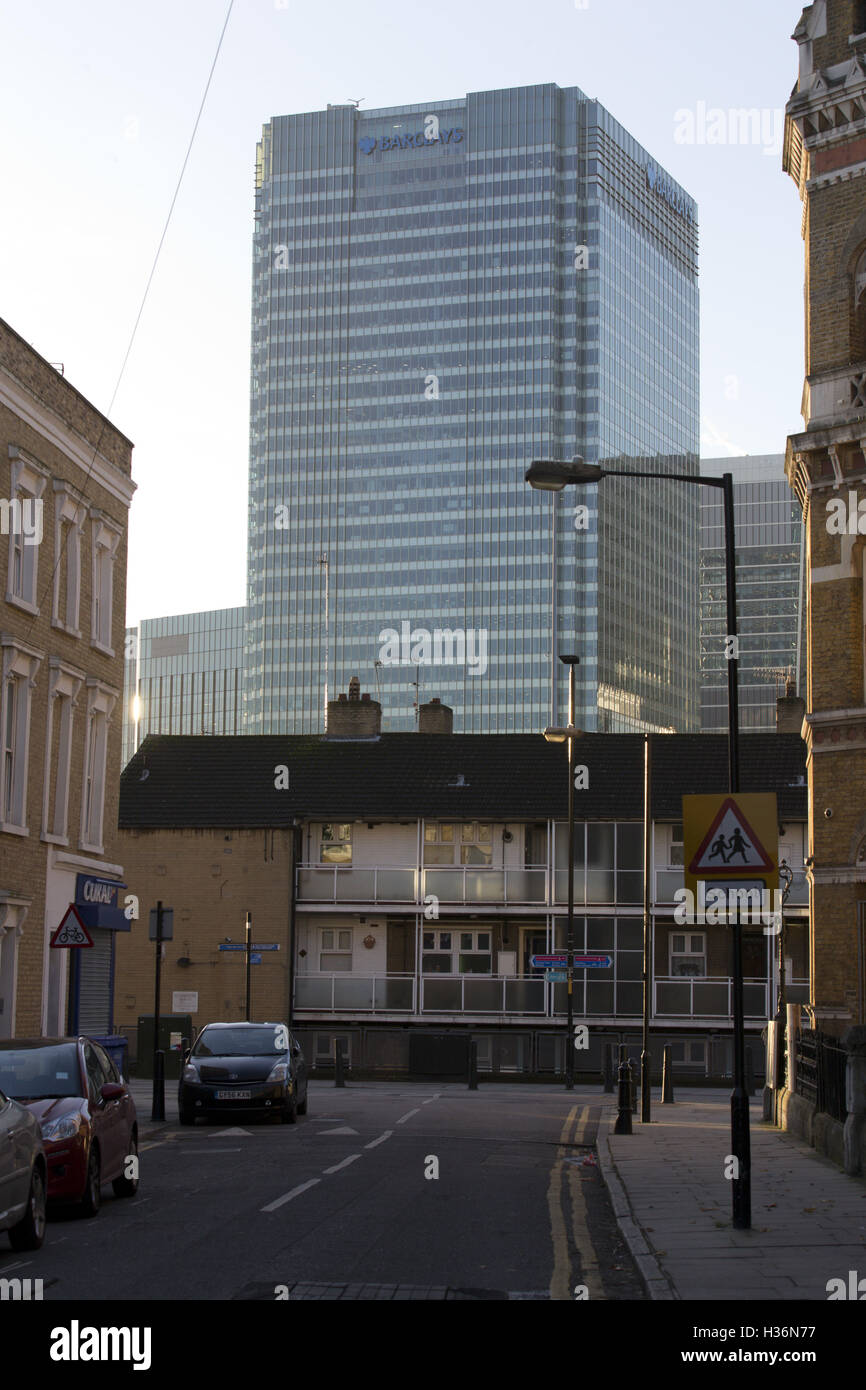 A housing estate in Tower Hamlets is pictured with the Barclays tower ...