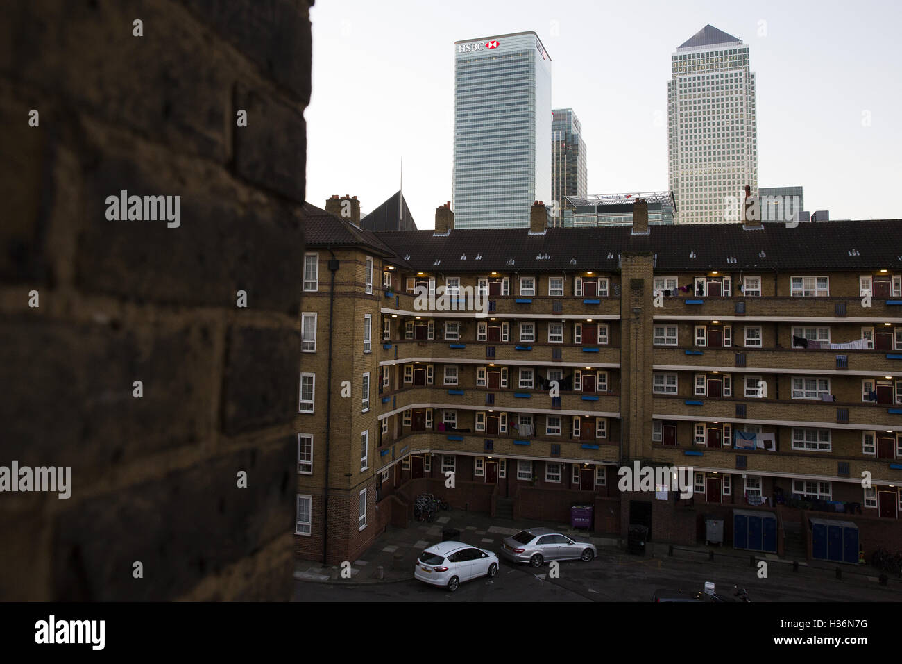 A Tower Hamlets estate is pictured with HSBC & No.1 Canada Square ...