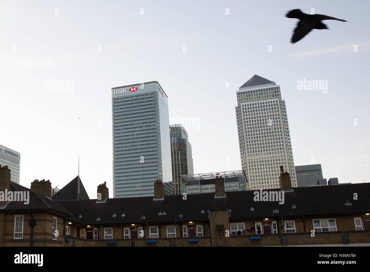 A Tower Hamlets estate is pictured with HSBC & No.1 Canada Square ...