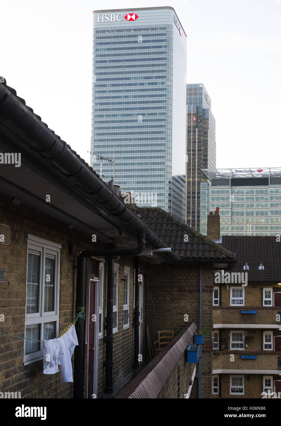 A Tower Hamlets estate is pictured with HSBC tower of Canary Wharf in ...