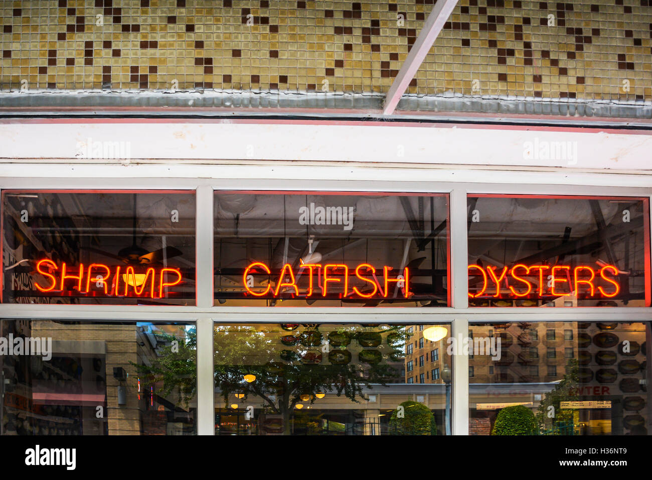 An old Restaurant 's storefront windows with Neon signs reading Shrimp ...