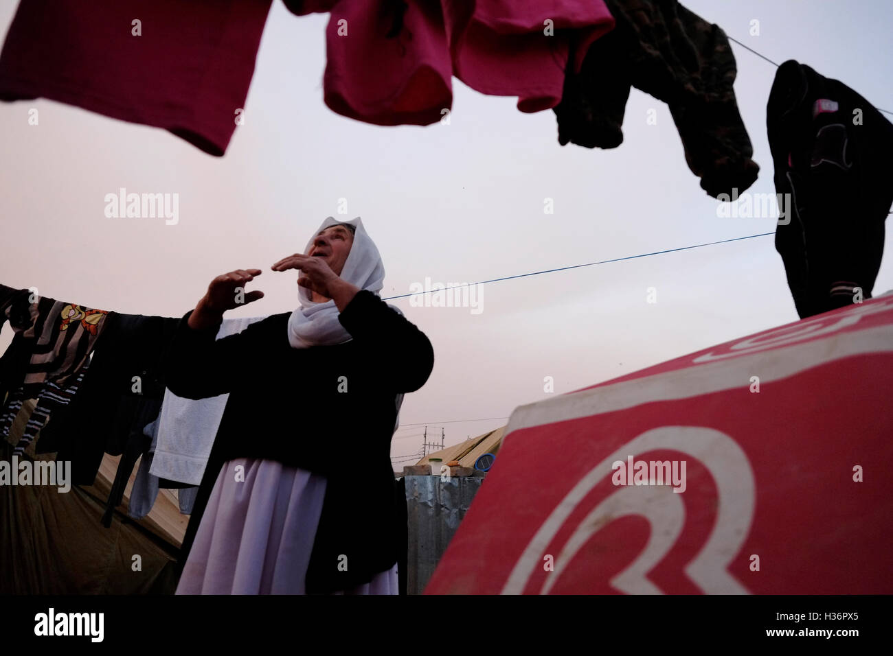 An elderly displaced woman from the minority Yazidi sect relating her ...