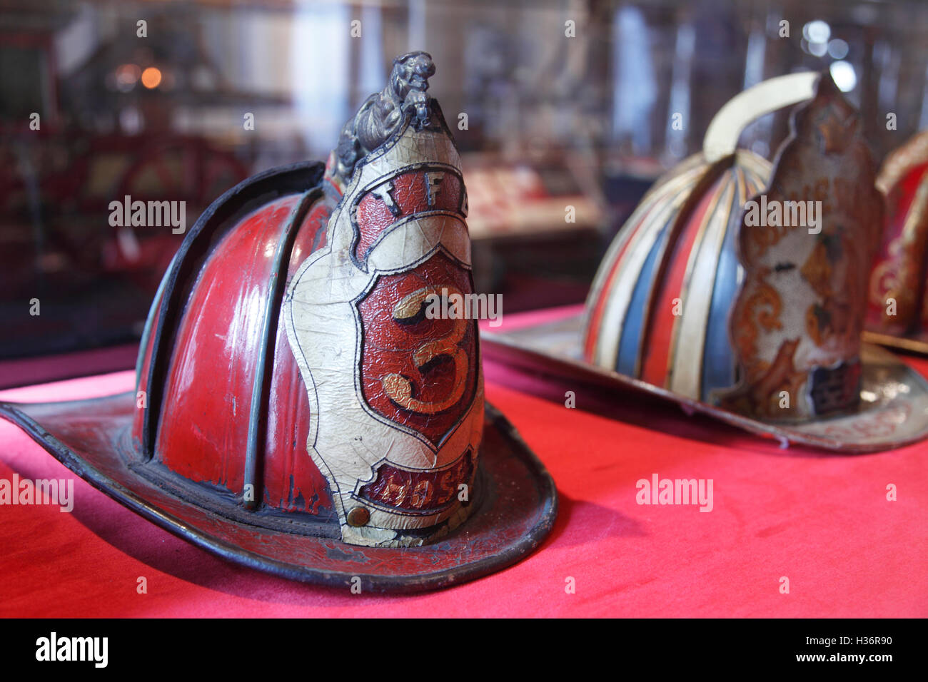 Old leather fire helmets display in New York City Fire Museum. New York ...