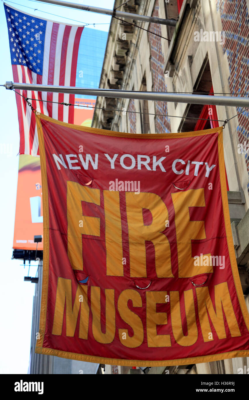 The banner of New York City Fire Museum with a US flag behind outside ...