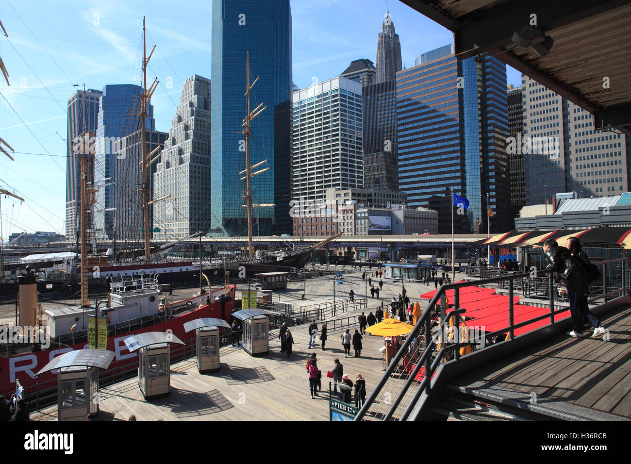 The view of South Street Seaport with the high-rise office towers of ...