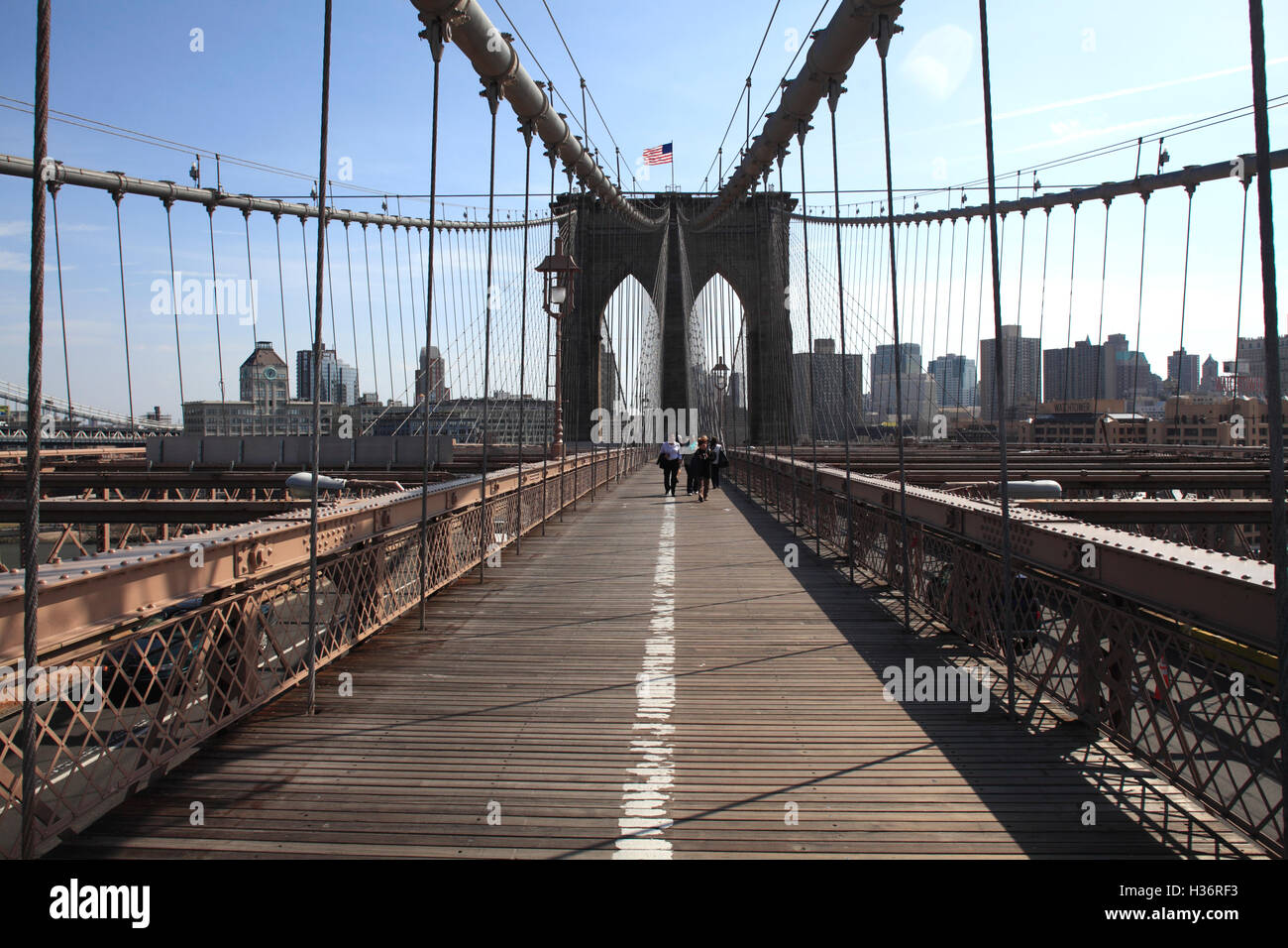 Suspension steel cables over pedestrian walkway of Brooklyn Bridge with ...