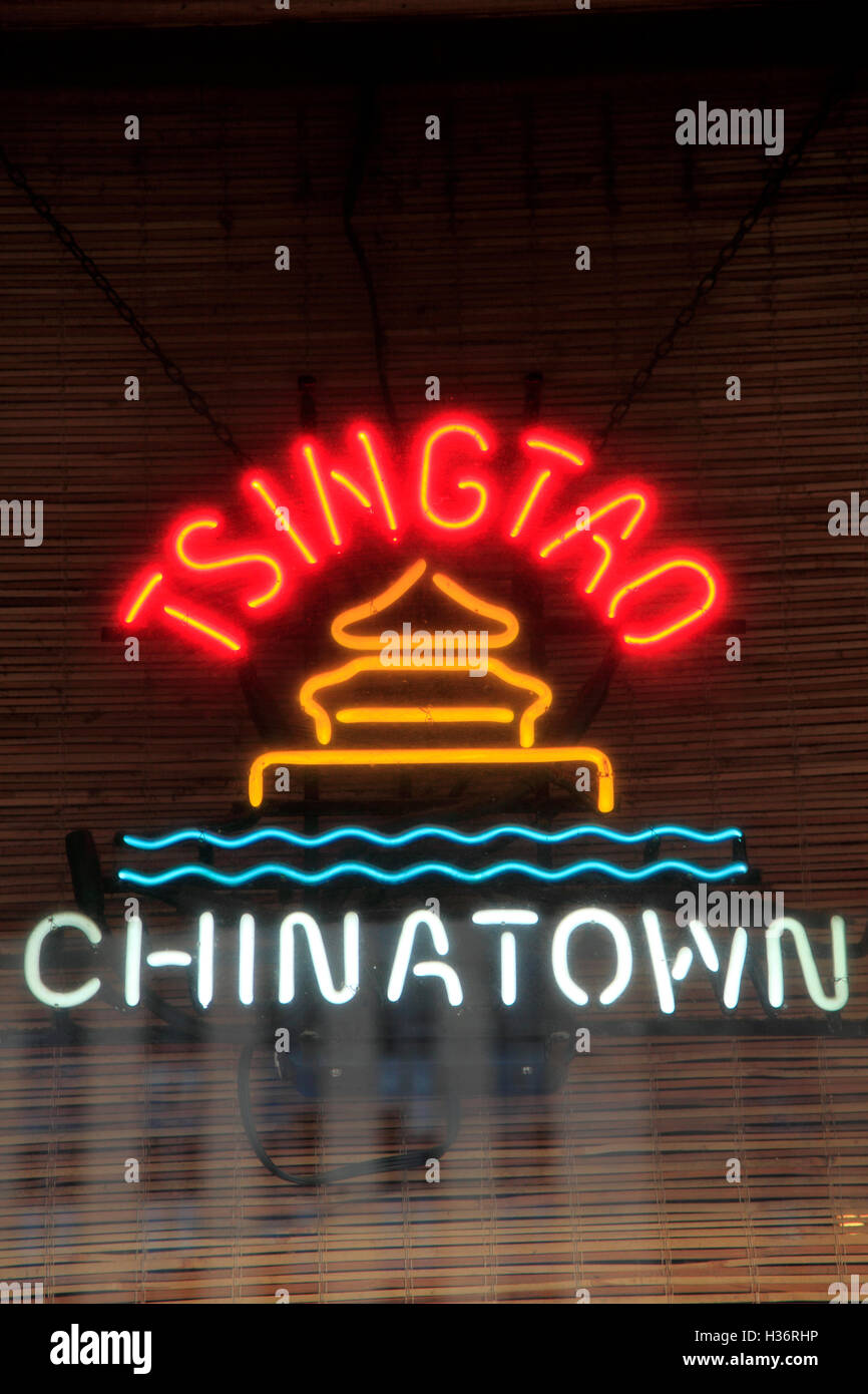Neon sign of Chinese TSINGTAO beer on a Chinatown restaurant window.New ...